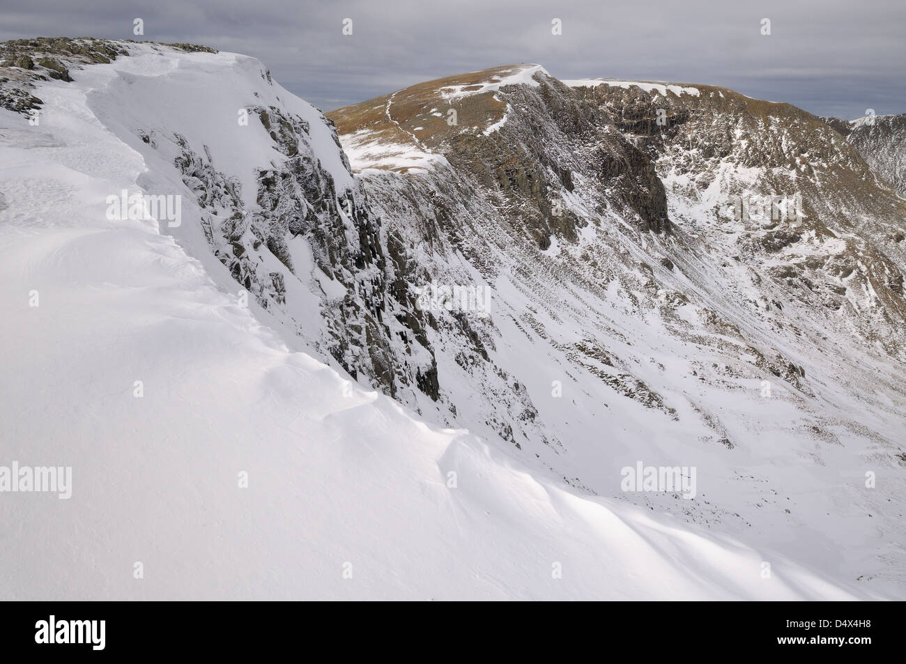 Ruthwaite Cove, High Crag and Nethermost Pike in winter in the English ...