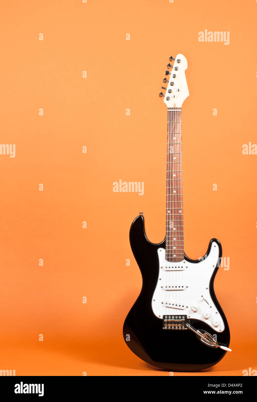 Orange electric guitar hi-res stock photography and images - Alamy