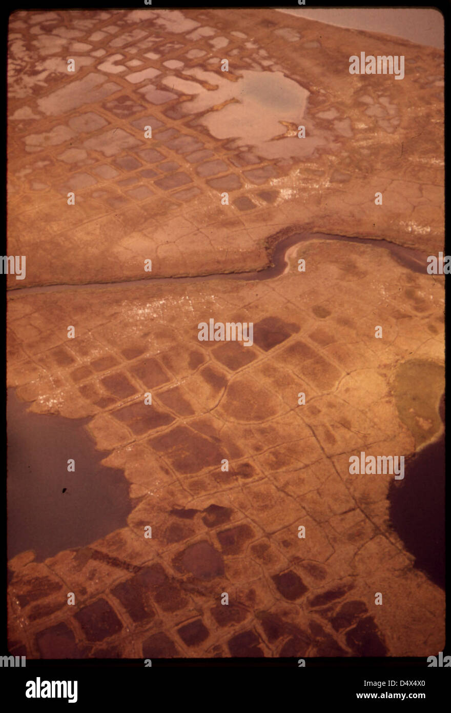 The image shows patterned ground formed by ice action, with a small ...