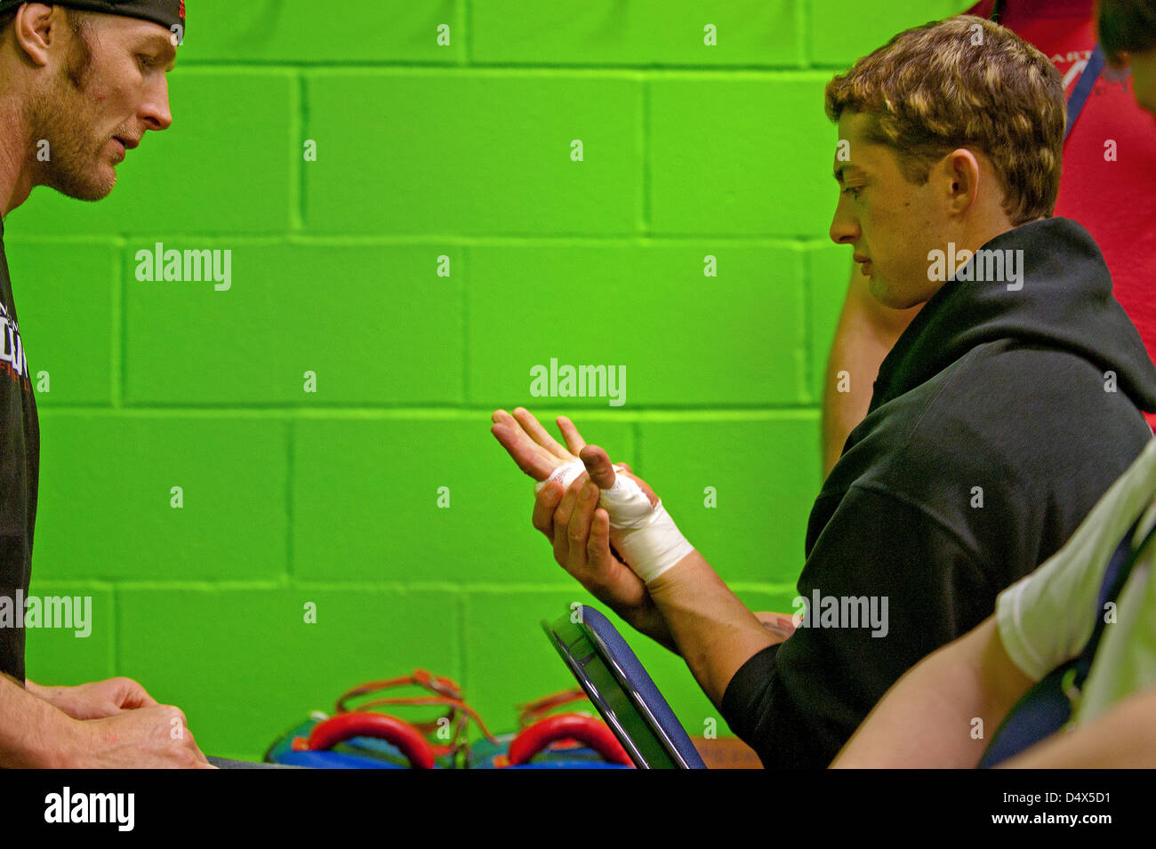 MMA fighter looking at hand Stock Photo - Alamy