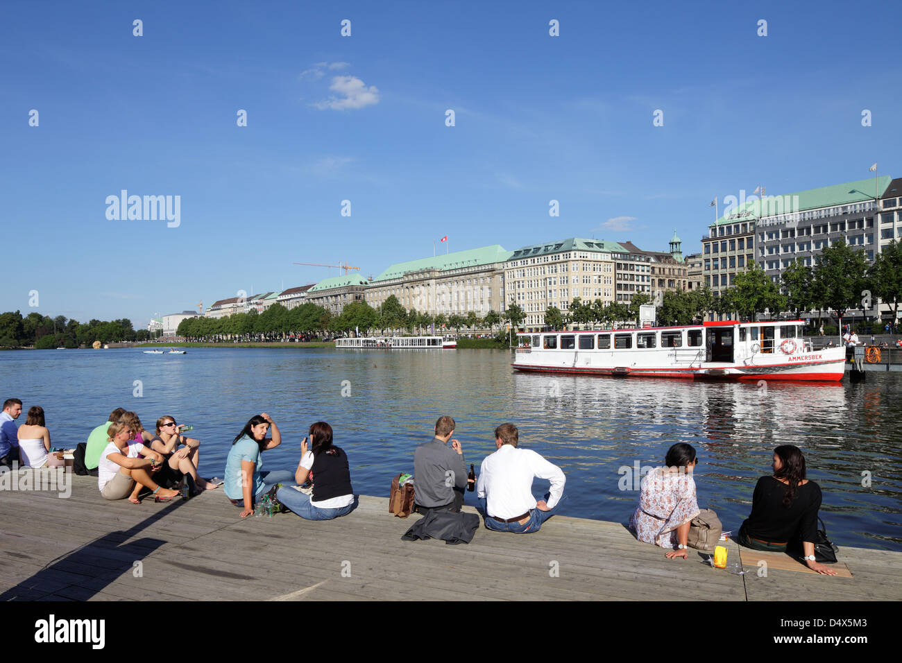 Hamburg, Germany, people are sitting on a jetty on the Inner Alster ...