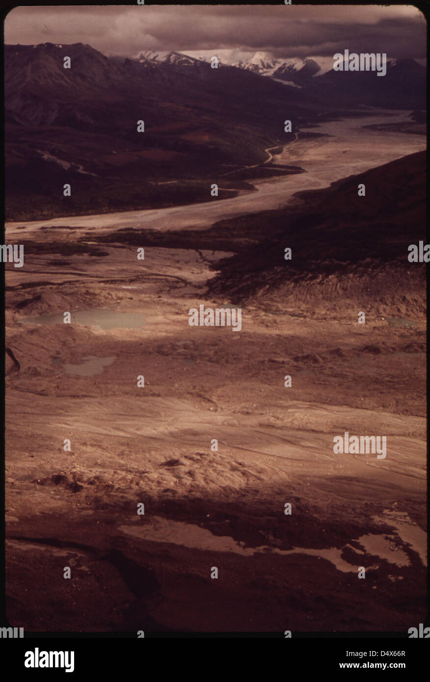 A photograph from August 1973 showing a view up the Delta River ...