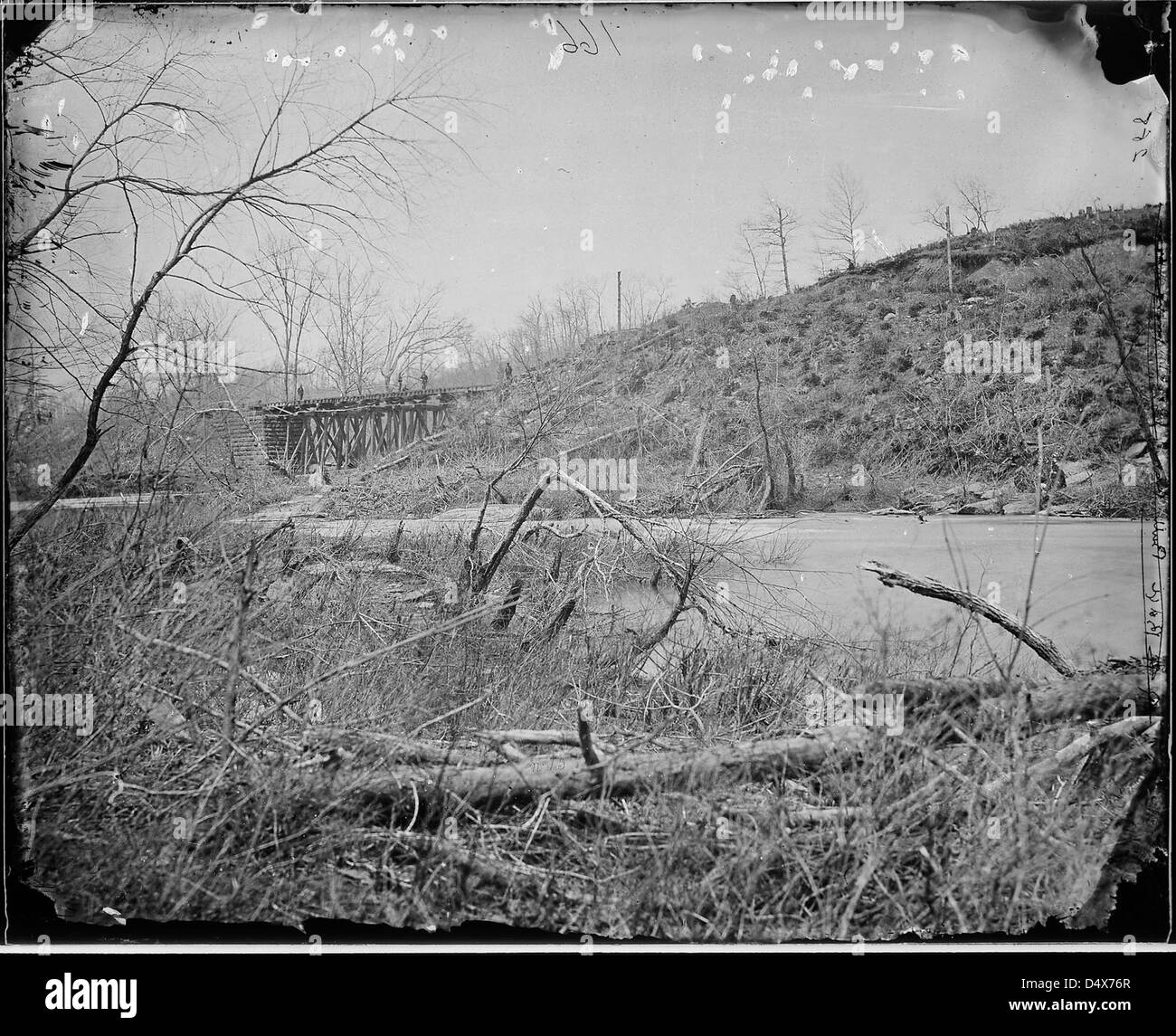 A photograph by Mathew Brady of a railroad bridge built across Bull Run ...