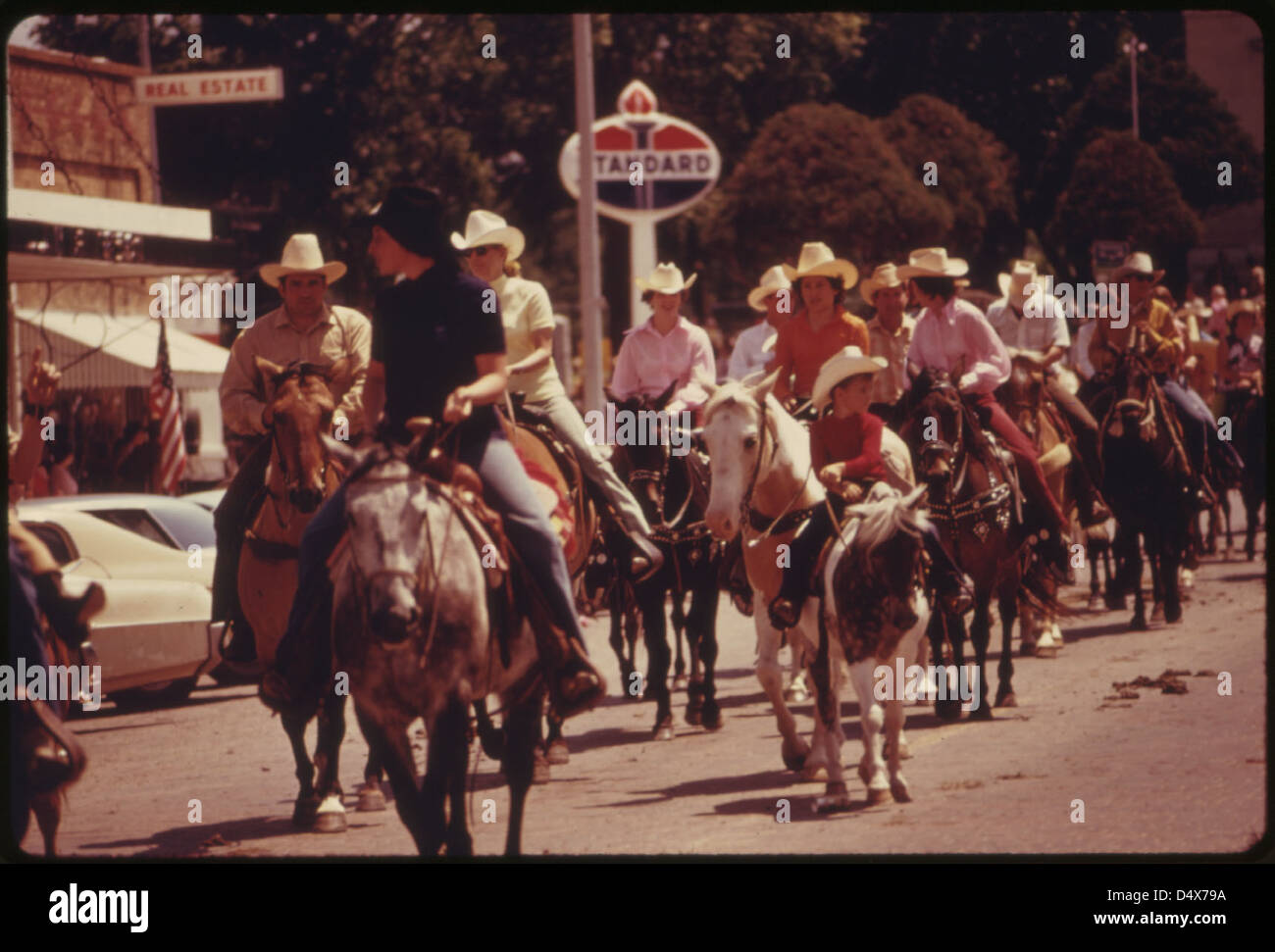 A photograph from June 1974 shows horse riders parading down the main ...