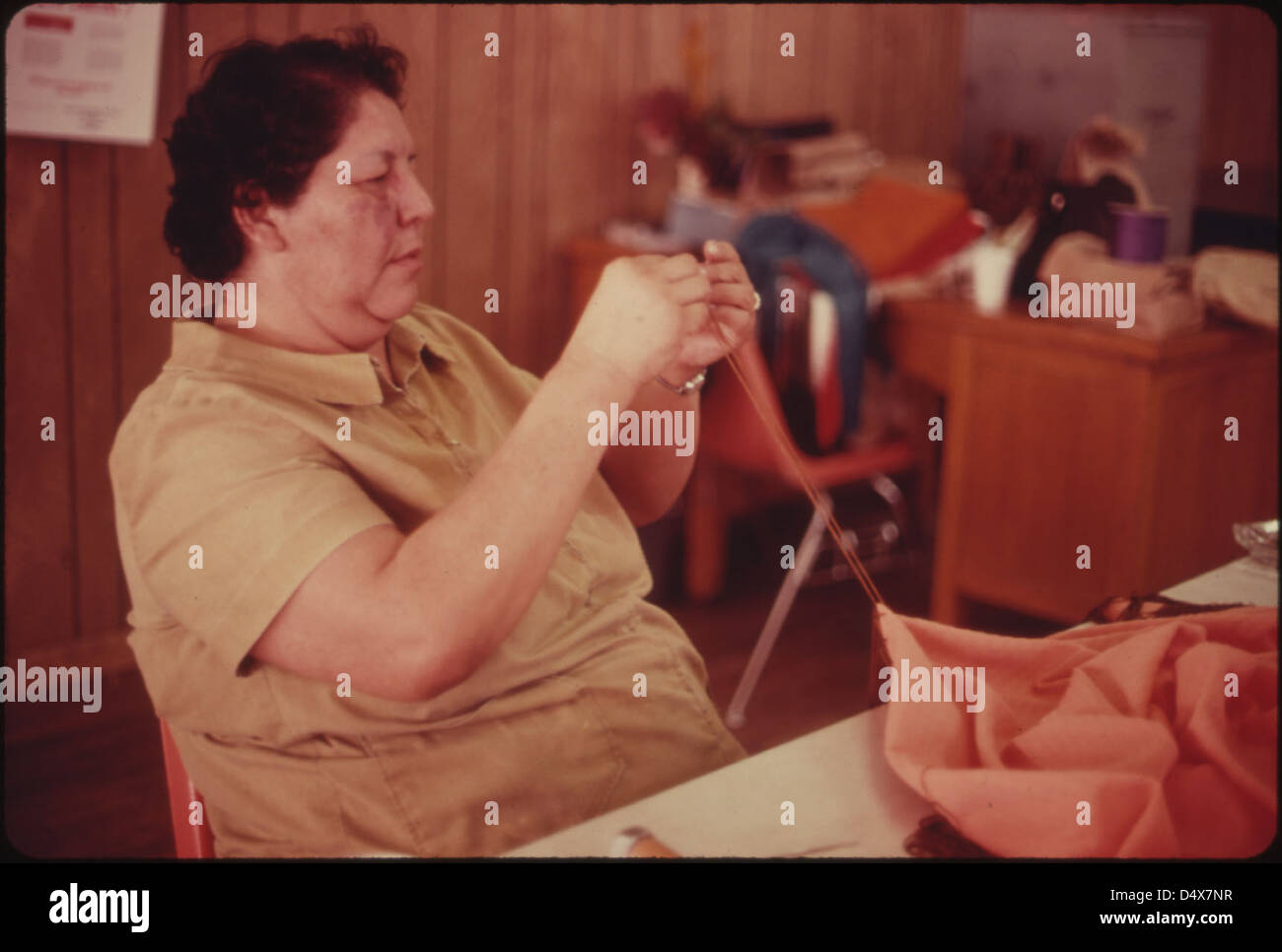 A great-granddaughter of Indian Chief White Cloud works on a shawl ...