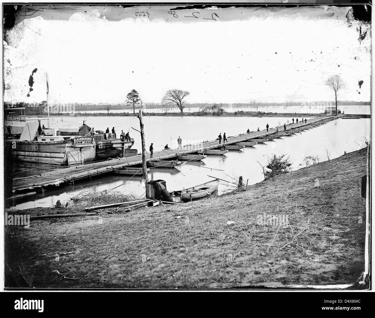 A historical photograph by Mathew Brady shows a pontoon bridge over the ...