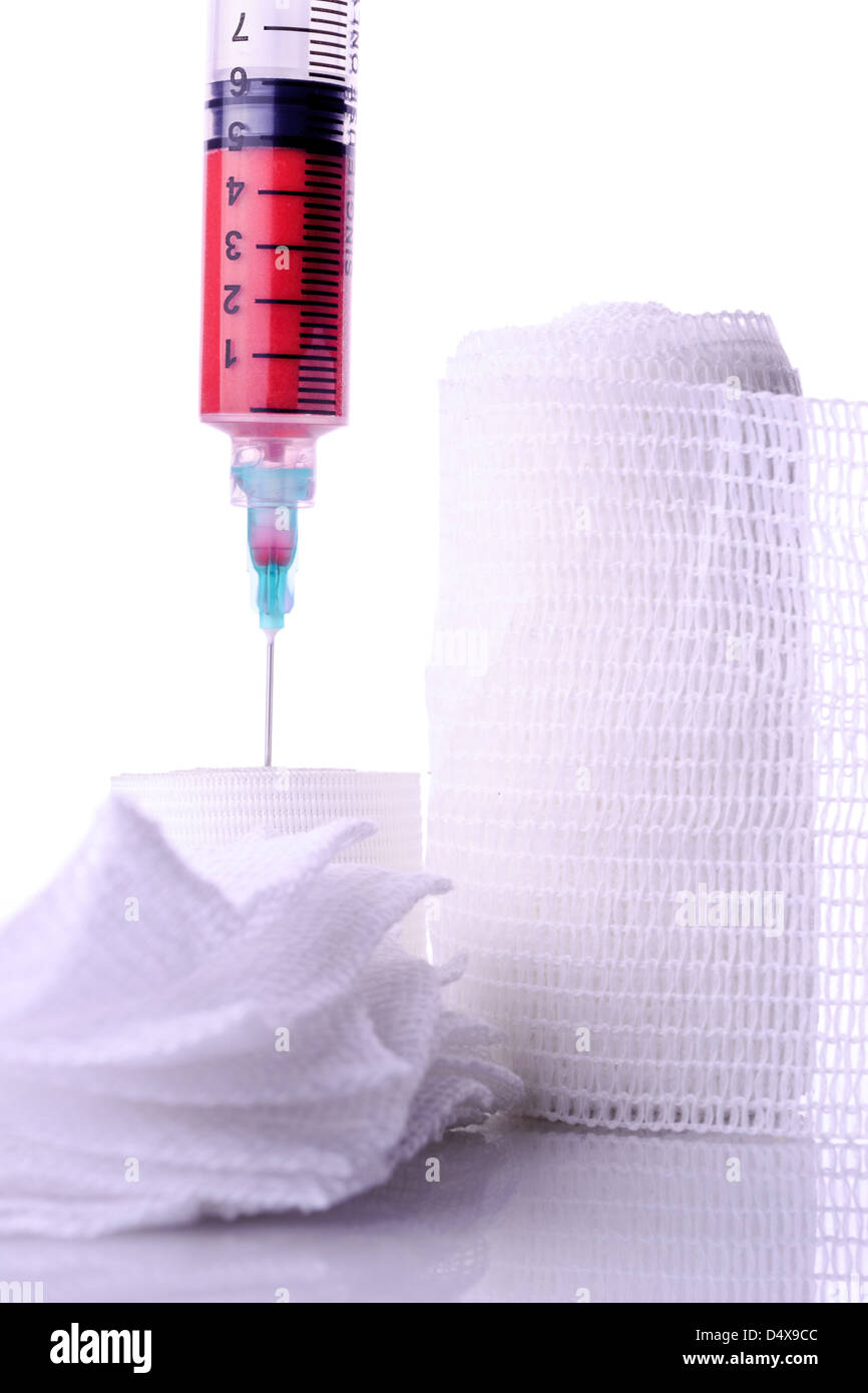 Syringe. Round Gauze Ball and Bandage Stock Photo - Alamy