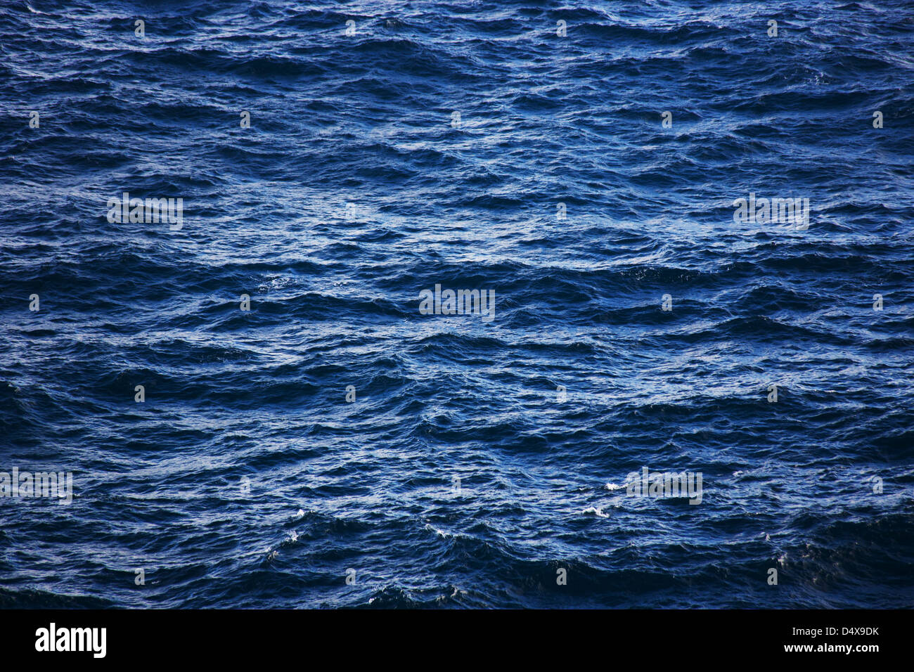 Waves in a blue sea Stock Photo - Alamy
