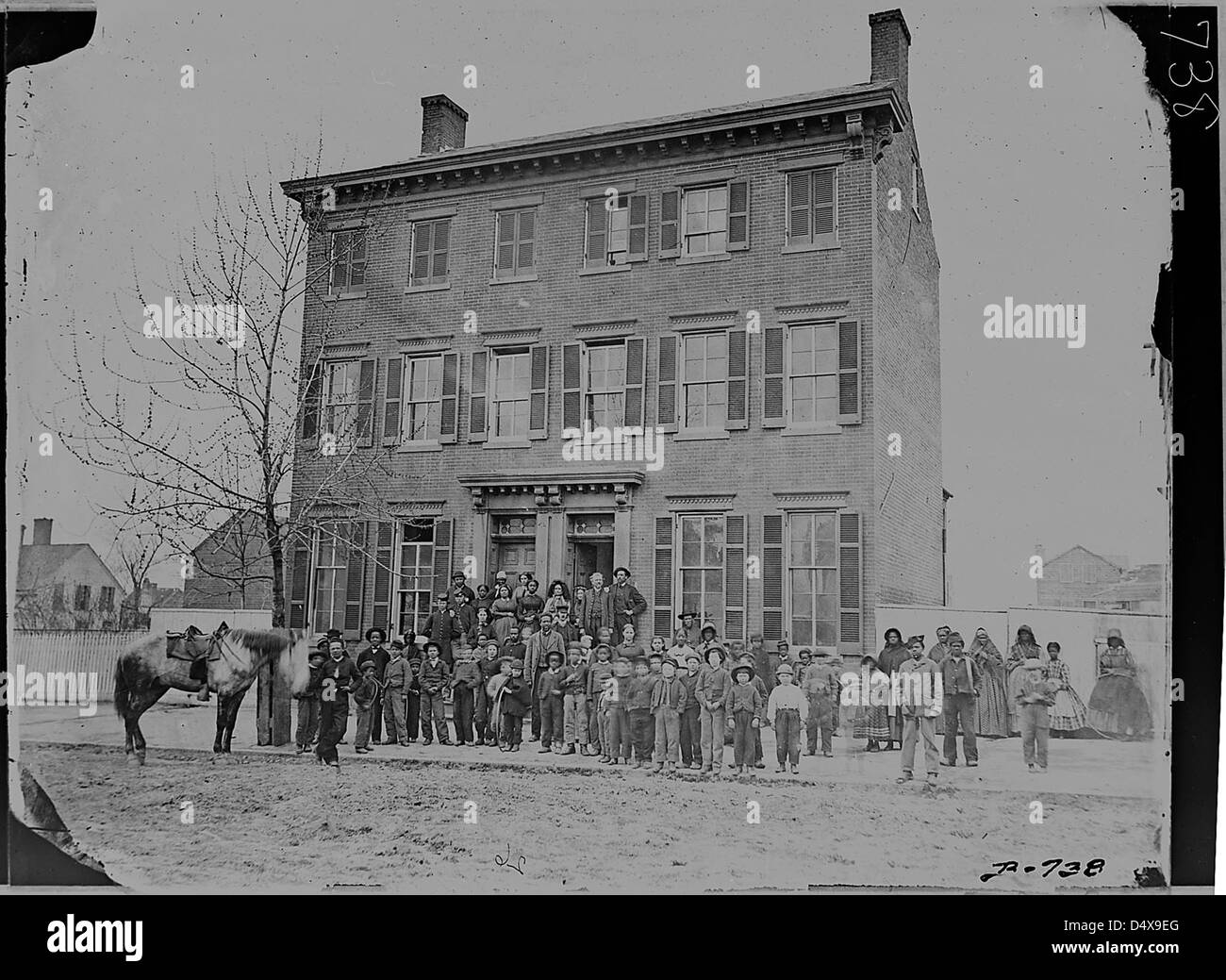 A photograph taken during the Civil War showing a house at the corner ...