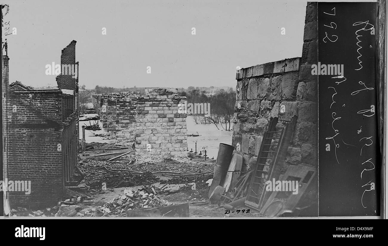 A photograph by Mathew Brady depicts the ruins of a railroad bridge ...