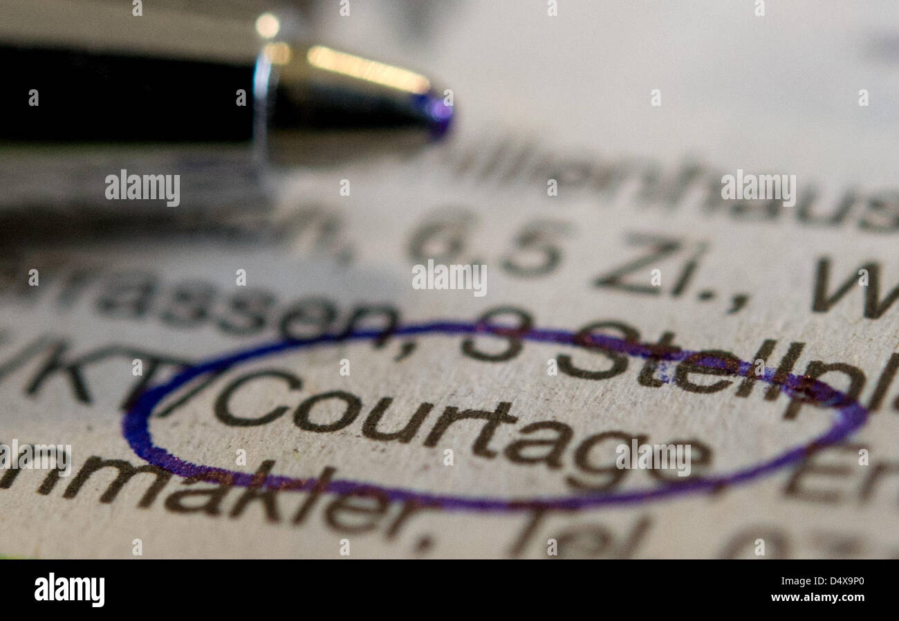 ILLUSTRATION - A pen lies next to an ad featured in the real estate ...