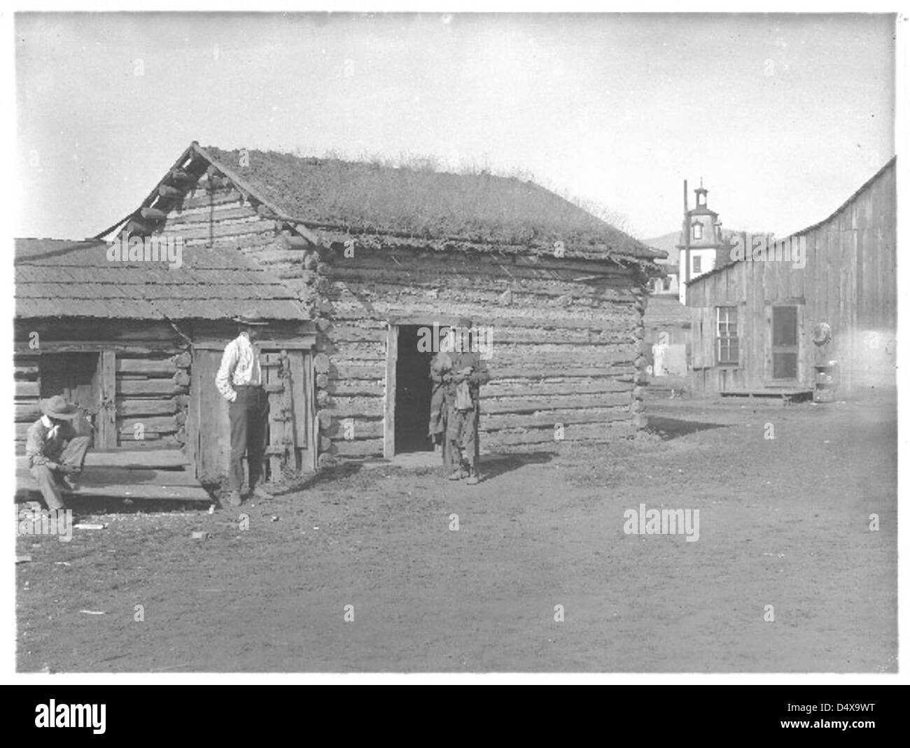Three Indian Men in Front of a Cabin Stock Photo - Alamy