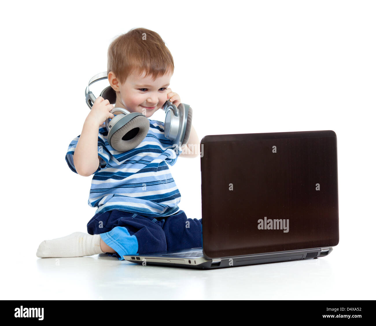 Funny child playing with laptop isolated on white background Stock ...