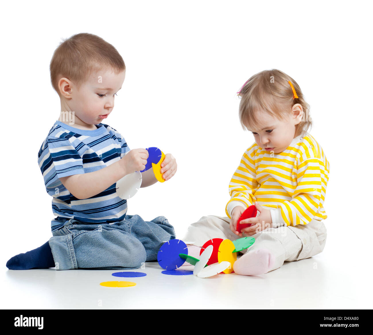 little children playing with color toy over white background Stock ...