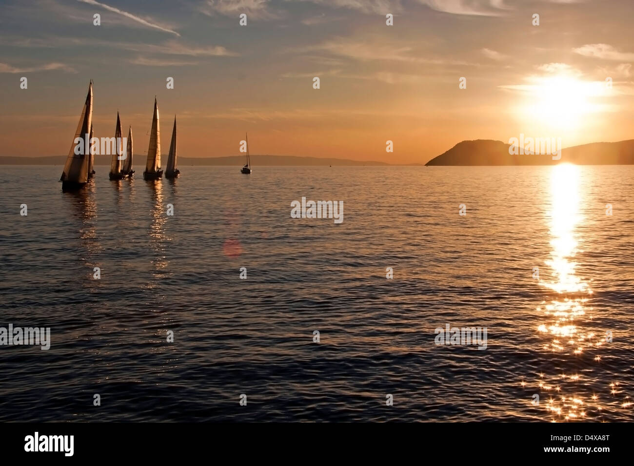 sailboats in sunset Stock Photo - Alamy