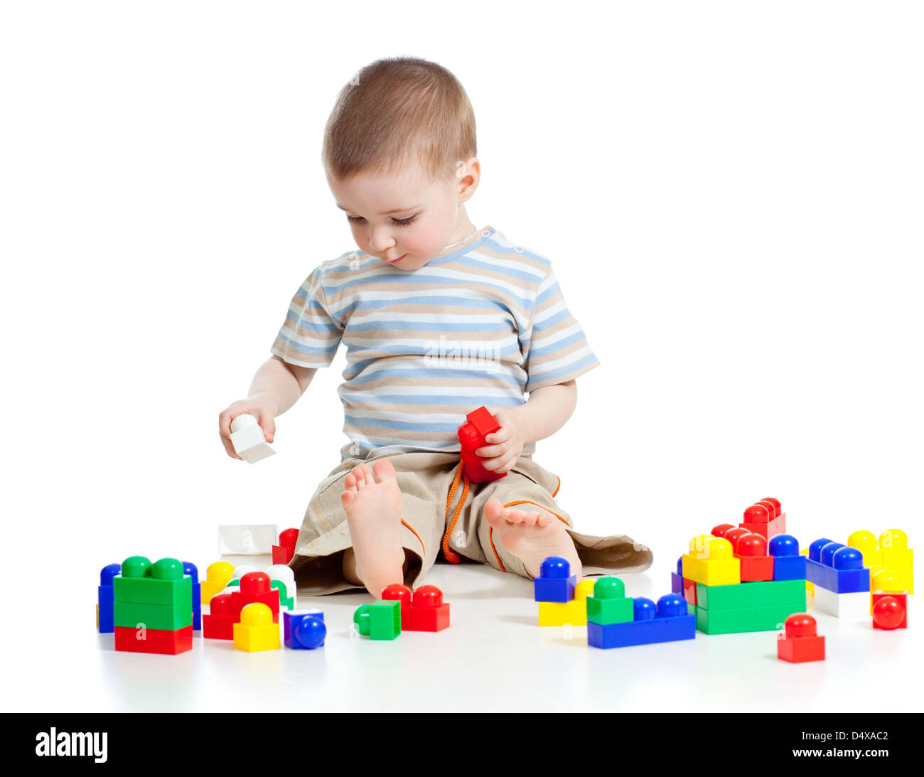 cheerful child boy with construction set over white background Stock ...