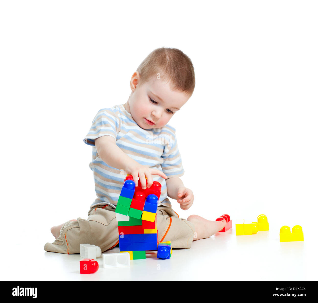 cheerful child boy with construction set over white background Stock ...