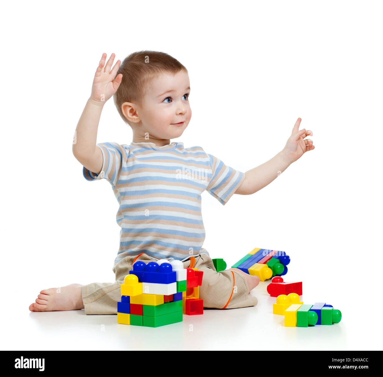 little cheerful child with construction set over white background Stock ...