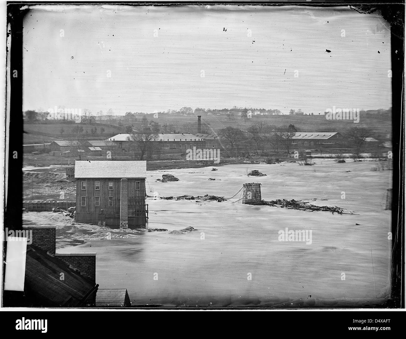 This photograph by Mathew Brady shows a railroad shop, a round house ...