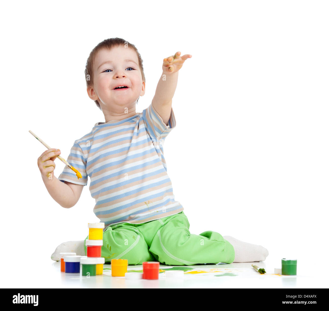 kid drawing with paints pointing directly Stock Photo - Alamy