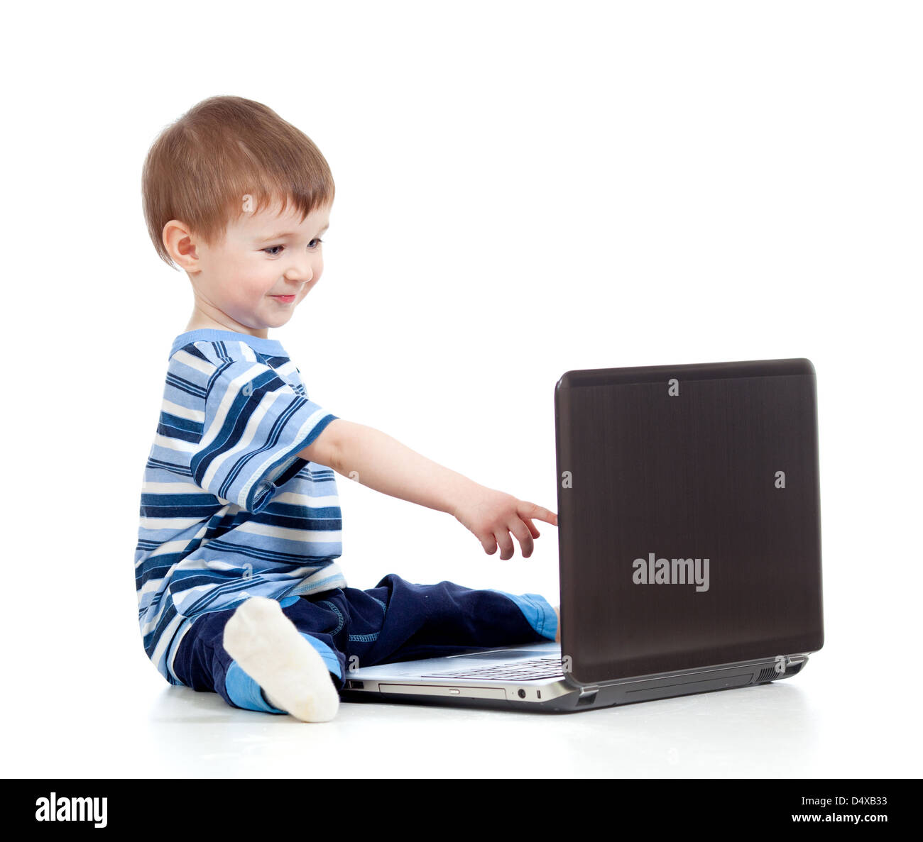 Funny child using a laptop over white background Stock Photo - Alamy