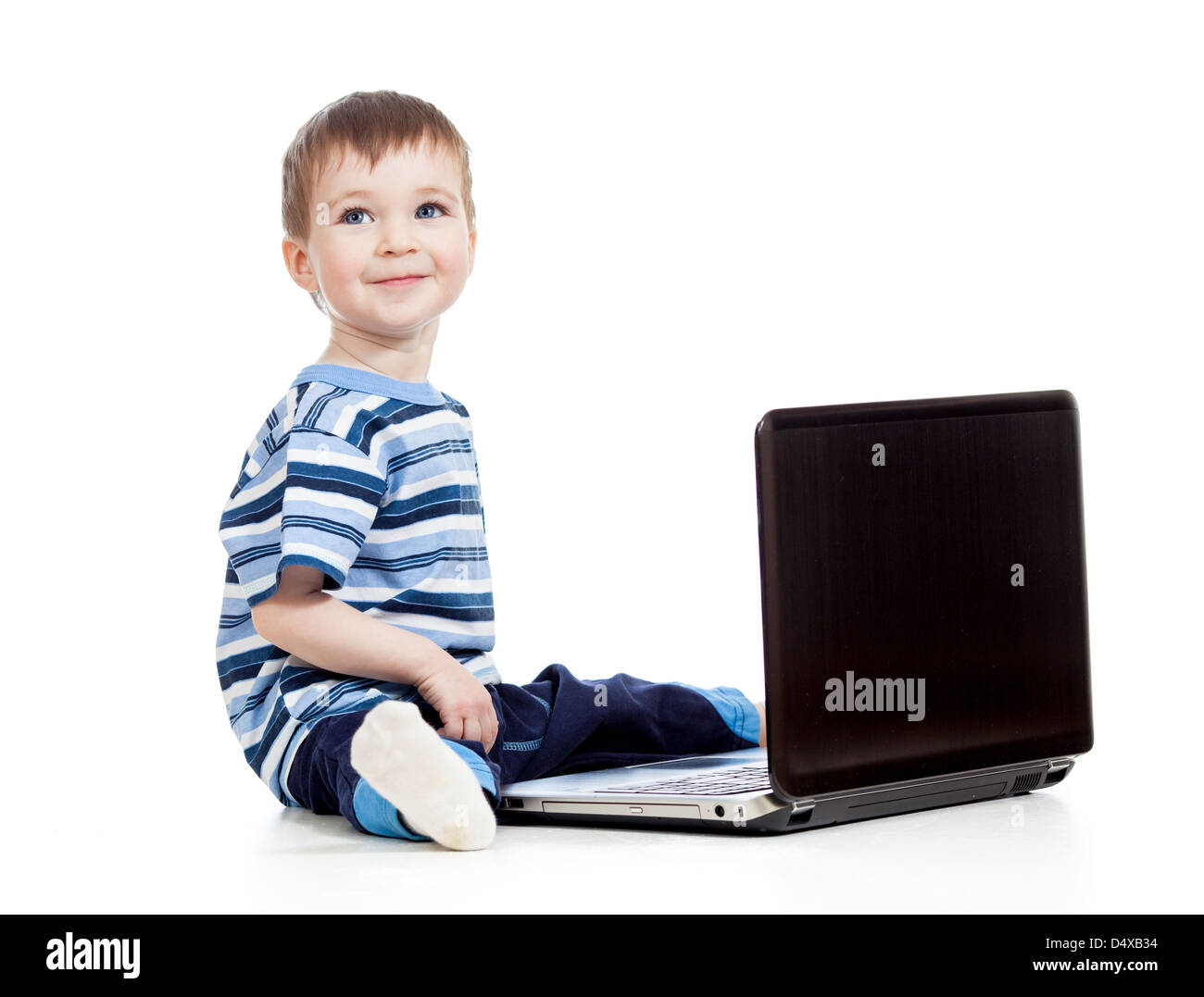 happy baby boy using a laptop over white background Stock Photo - Alamy