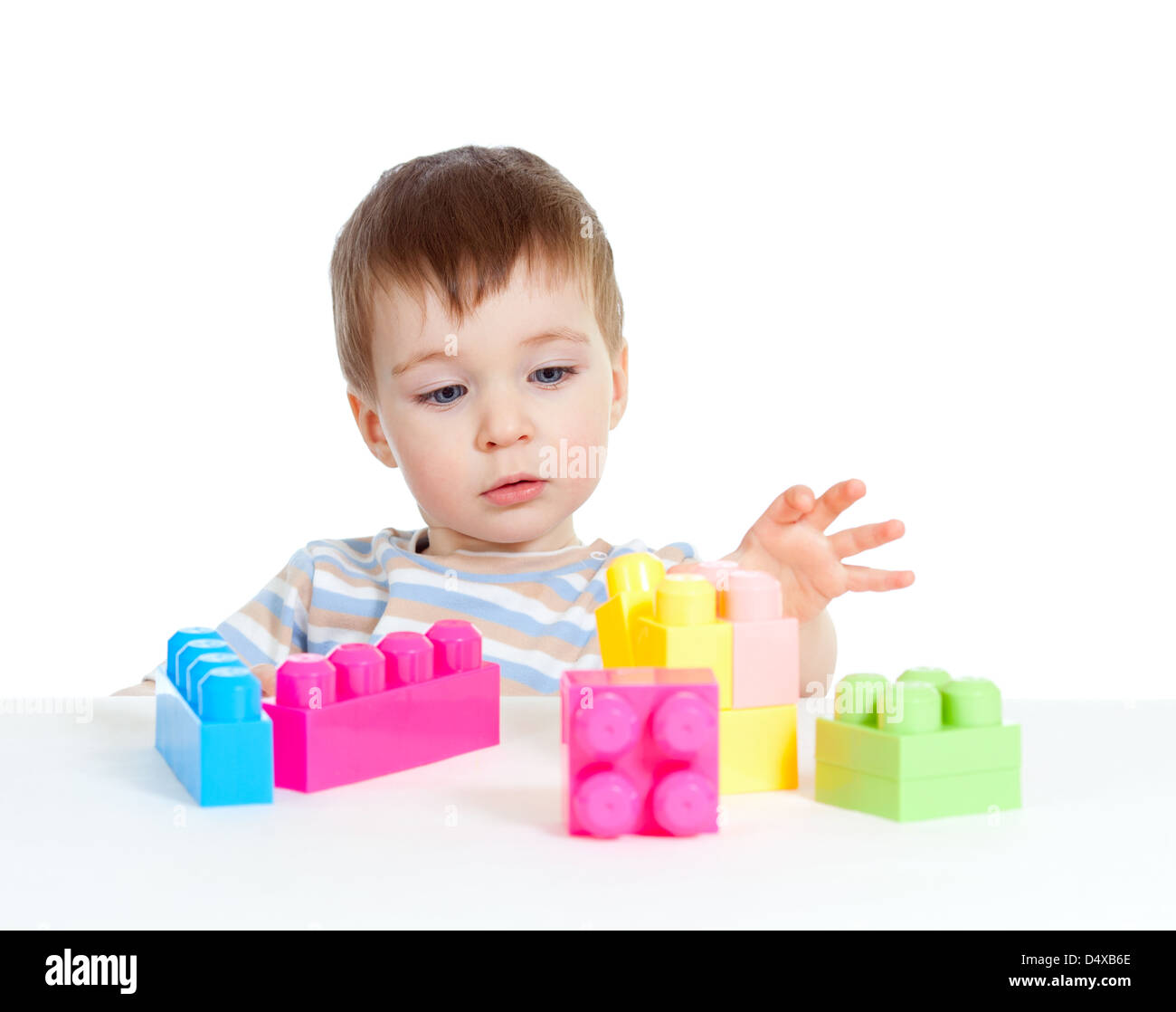 little cheerful child with construction set over white background Stock ...