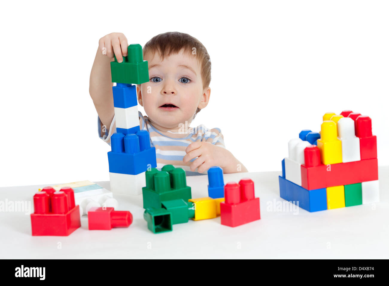 little cheerful child with construction set over white background Stock ...
