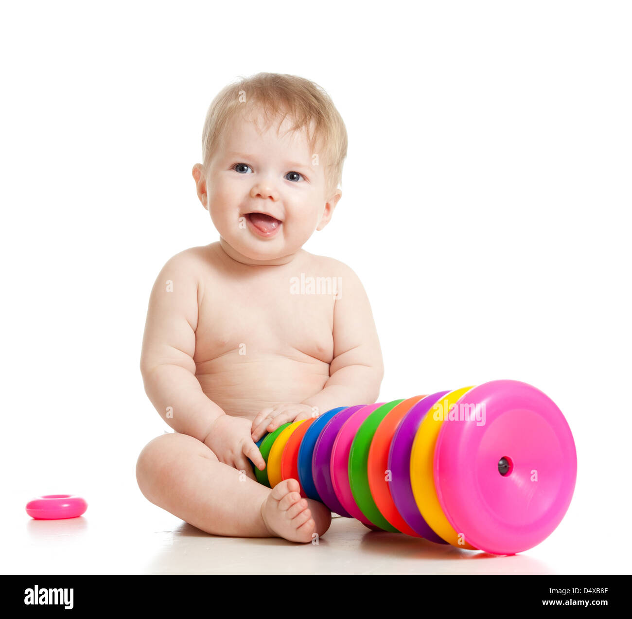 smiling child playing with color toy Stock Photo - Alamy
