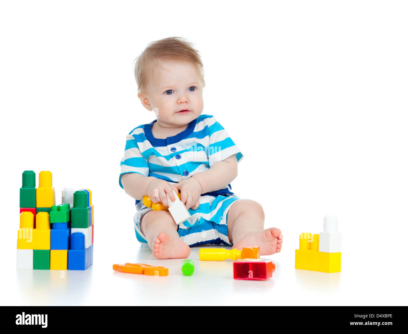 little cheerful child with construction set over white background Stock ...