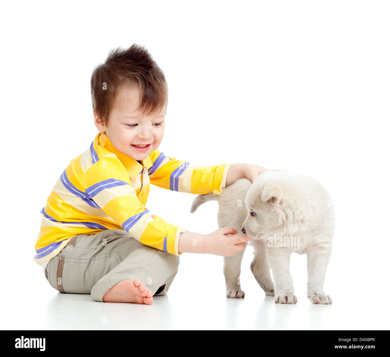 Boy with puppy Cut Out Stock Images & Pictures - Alamy