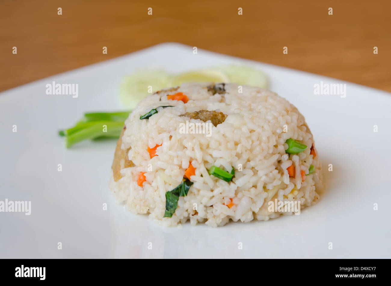 Mixed cooked rice with fried fish and sauce , served with fresh ...