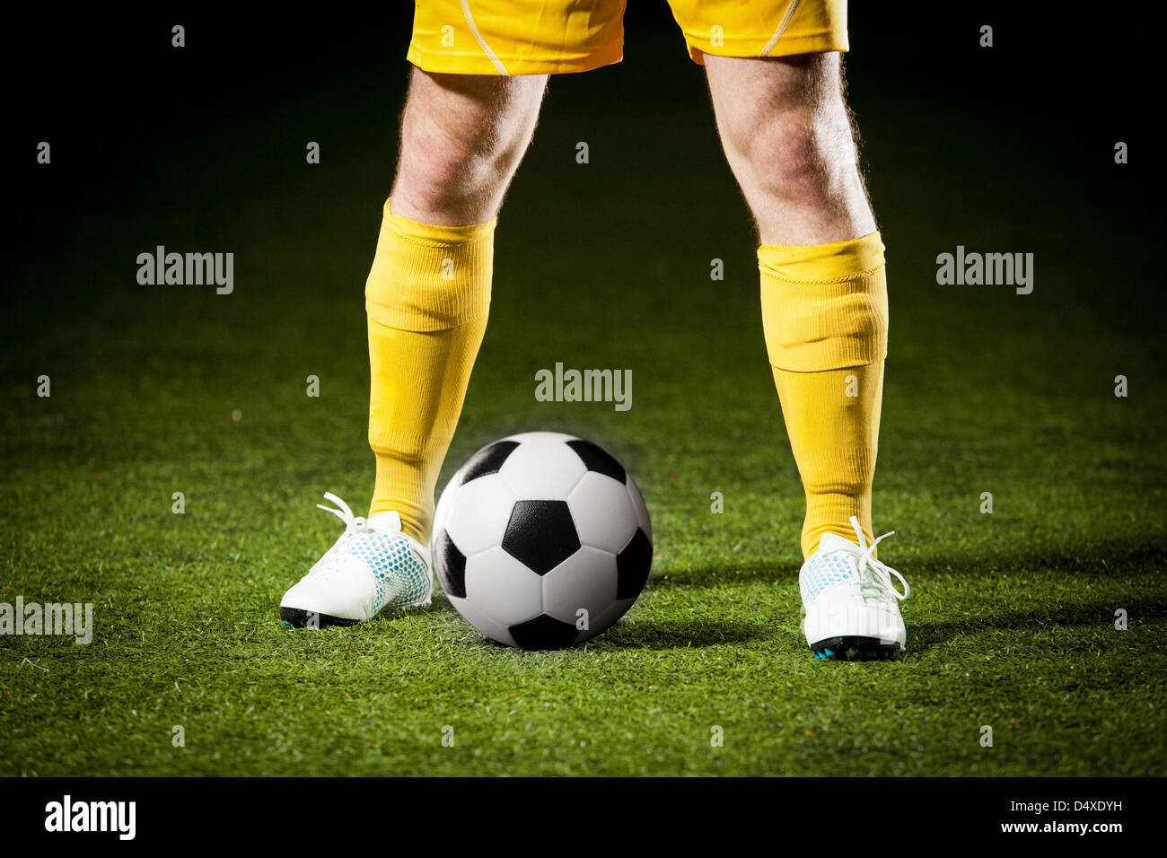 Feet of red team soccer player hi-res stock photography and images - Alamy