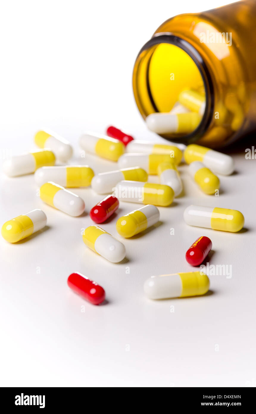 many pills lie on white underground before medication canister Stock ...