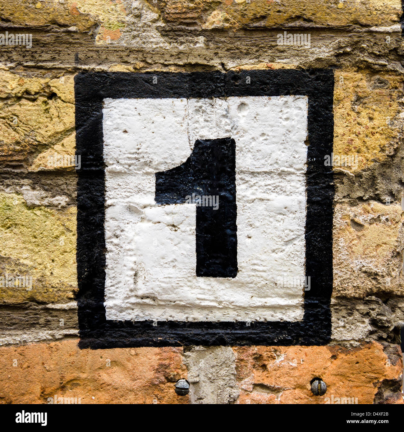 house number one, painted on a brick wall Stock Photo - Alamy