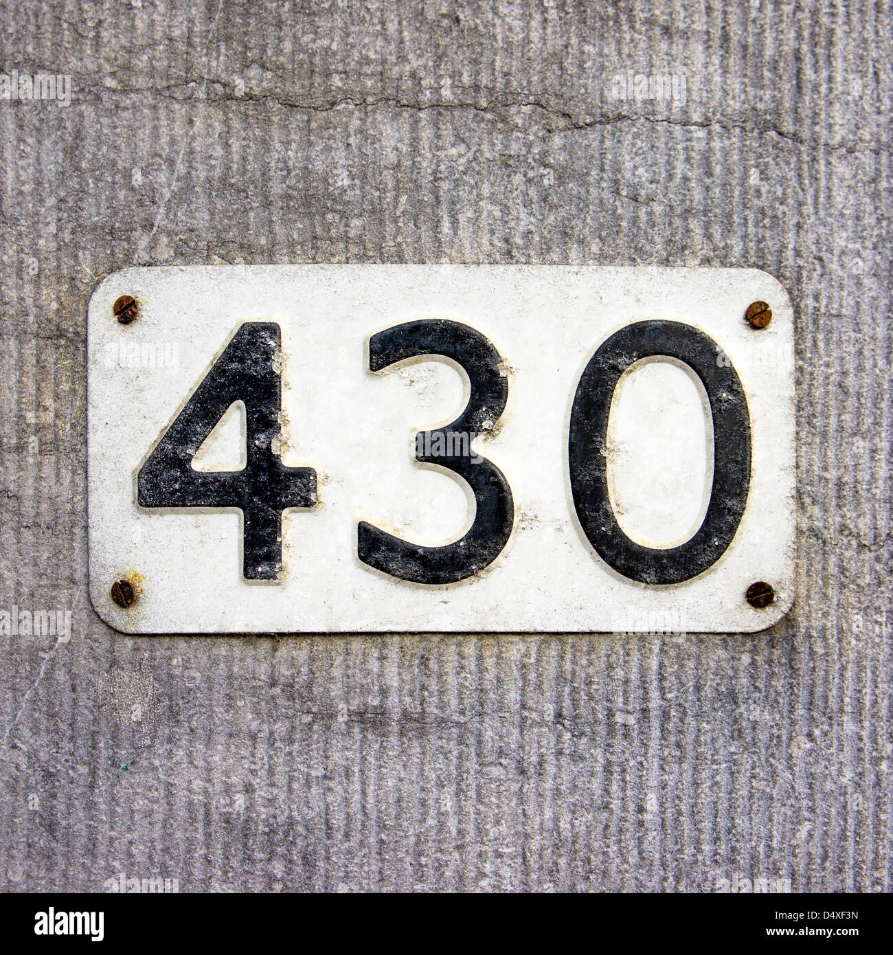 house number four hundred and thirty. Black lettering embossed in a ...