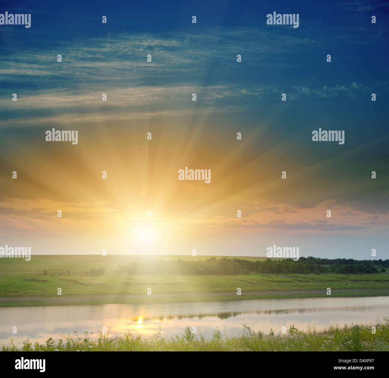 good sunset over field and river Stock Photo - Alamy