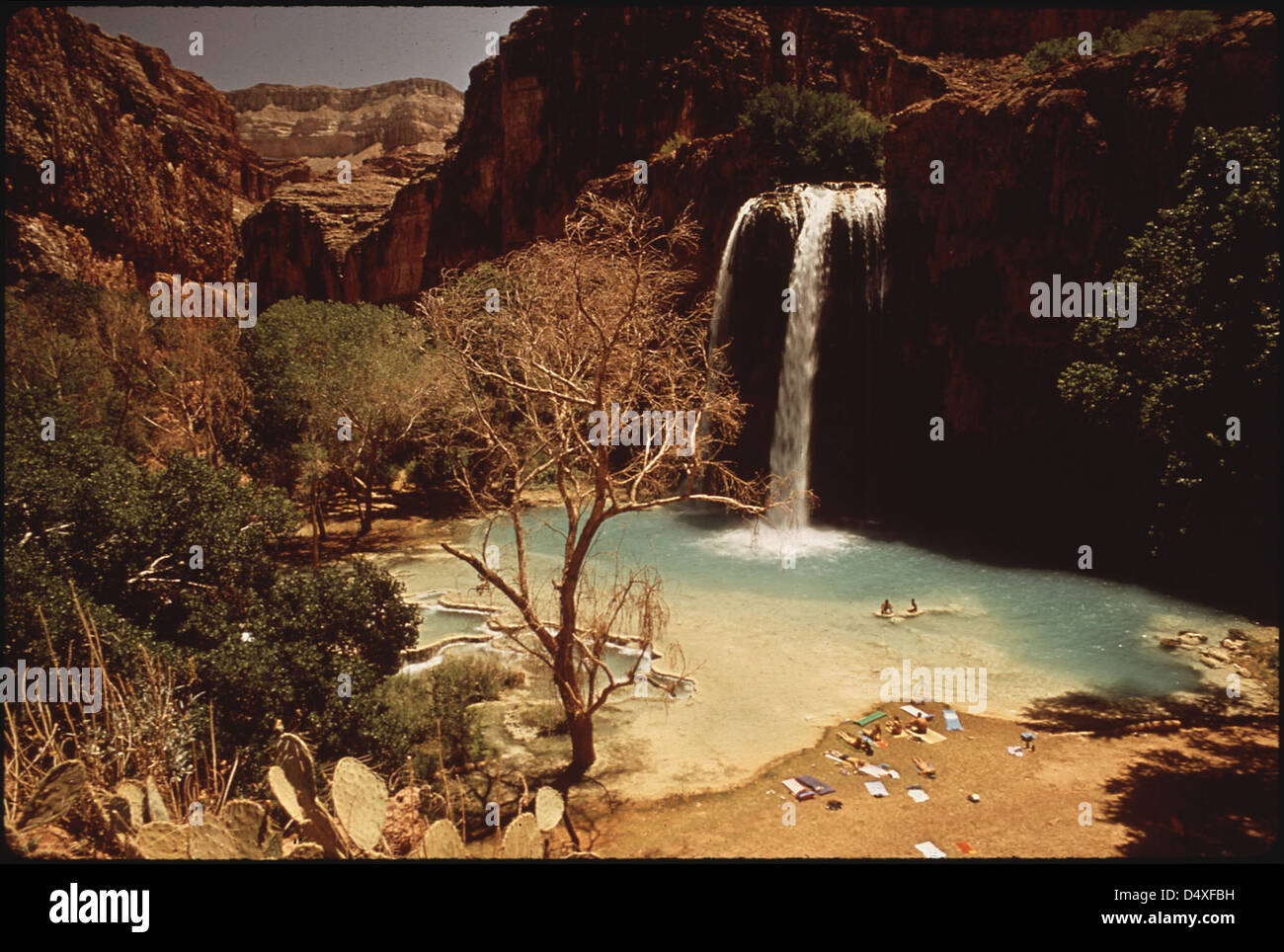 A photograph showing tourists bathing in the natural pool of Havasu ...