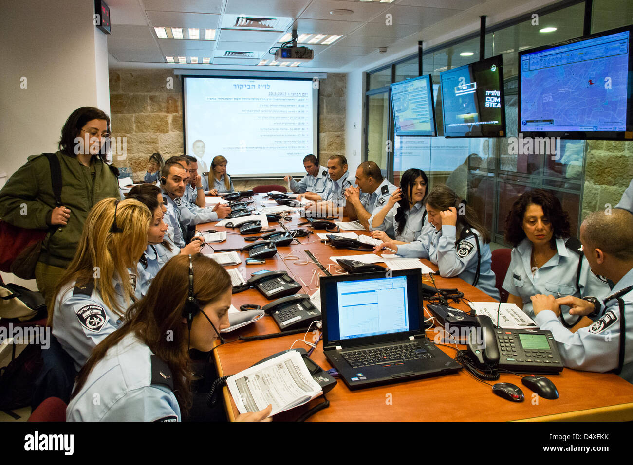 Twenty police officers staff the Jerusalem Police District Information ...