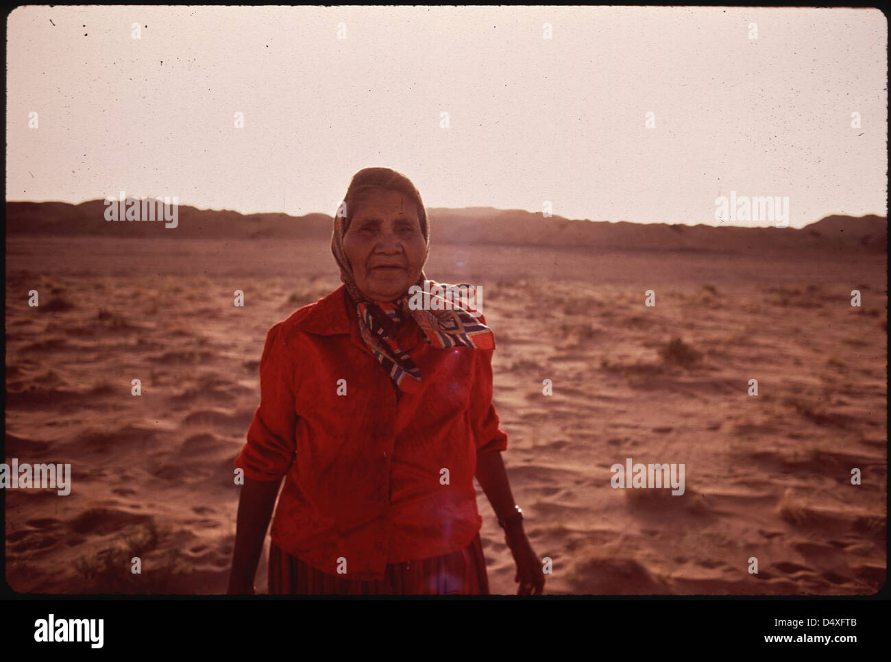 A photo depicting a Navajo woman in the desert, showcasing traditional ...