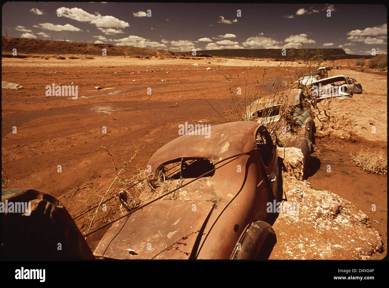 Old cars are repurposed as water-breaks on the Navajo Reservation ...