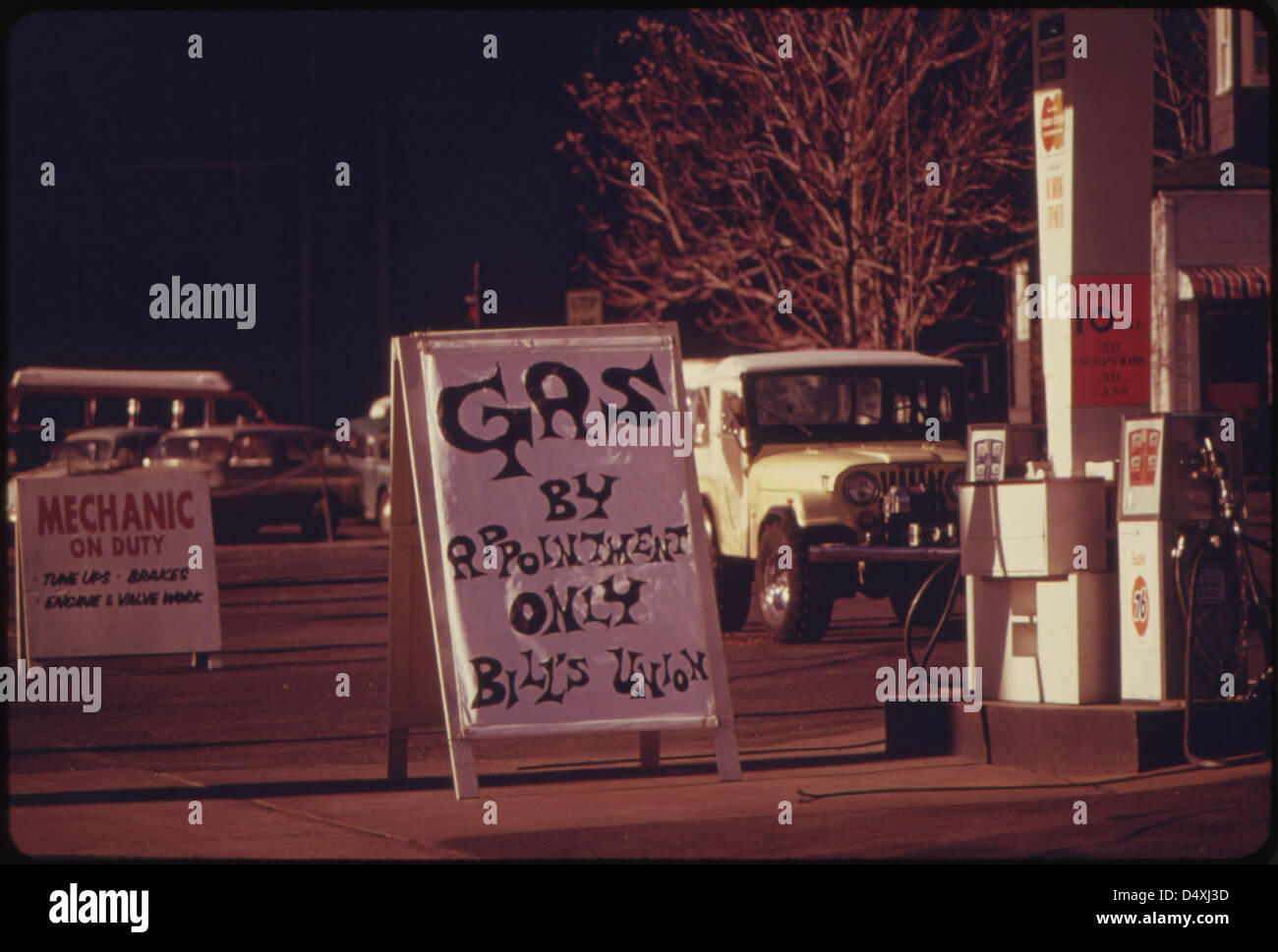A photograph from January 1974 showing signs indicating gas shortages ...