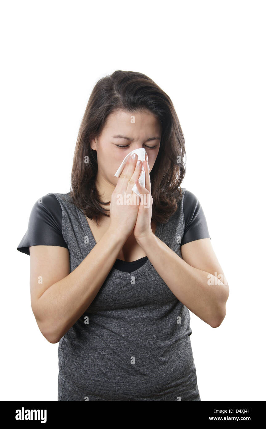 young woman blowing nose with paper tissue Stock Photo - Alamy