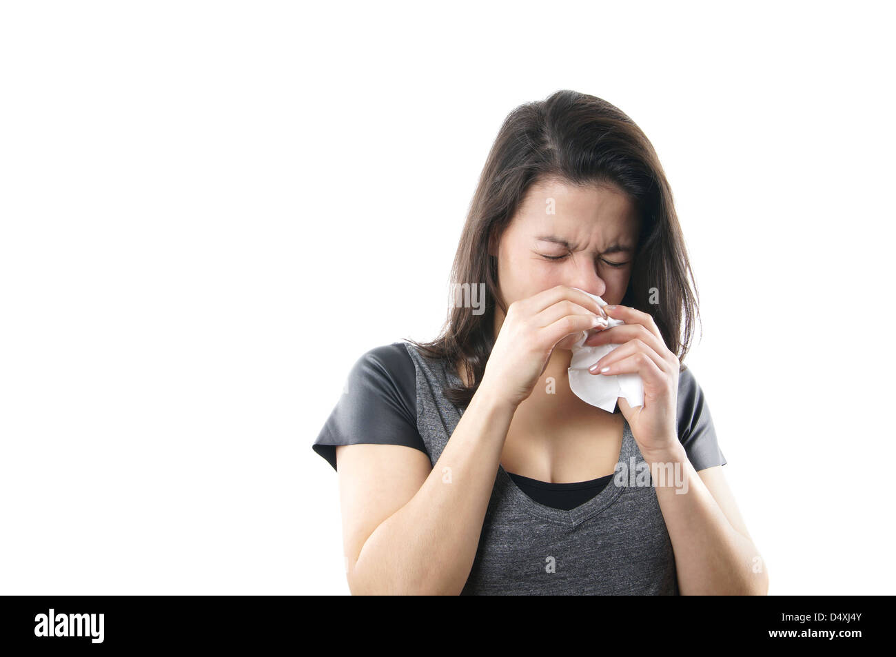 young woman blowing nose with paper tissue Stock Photo - Alamy
