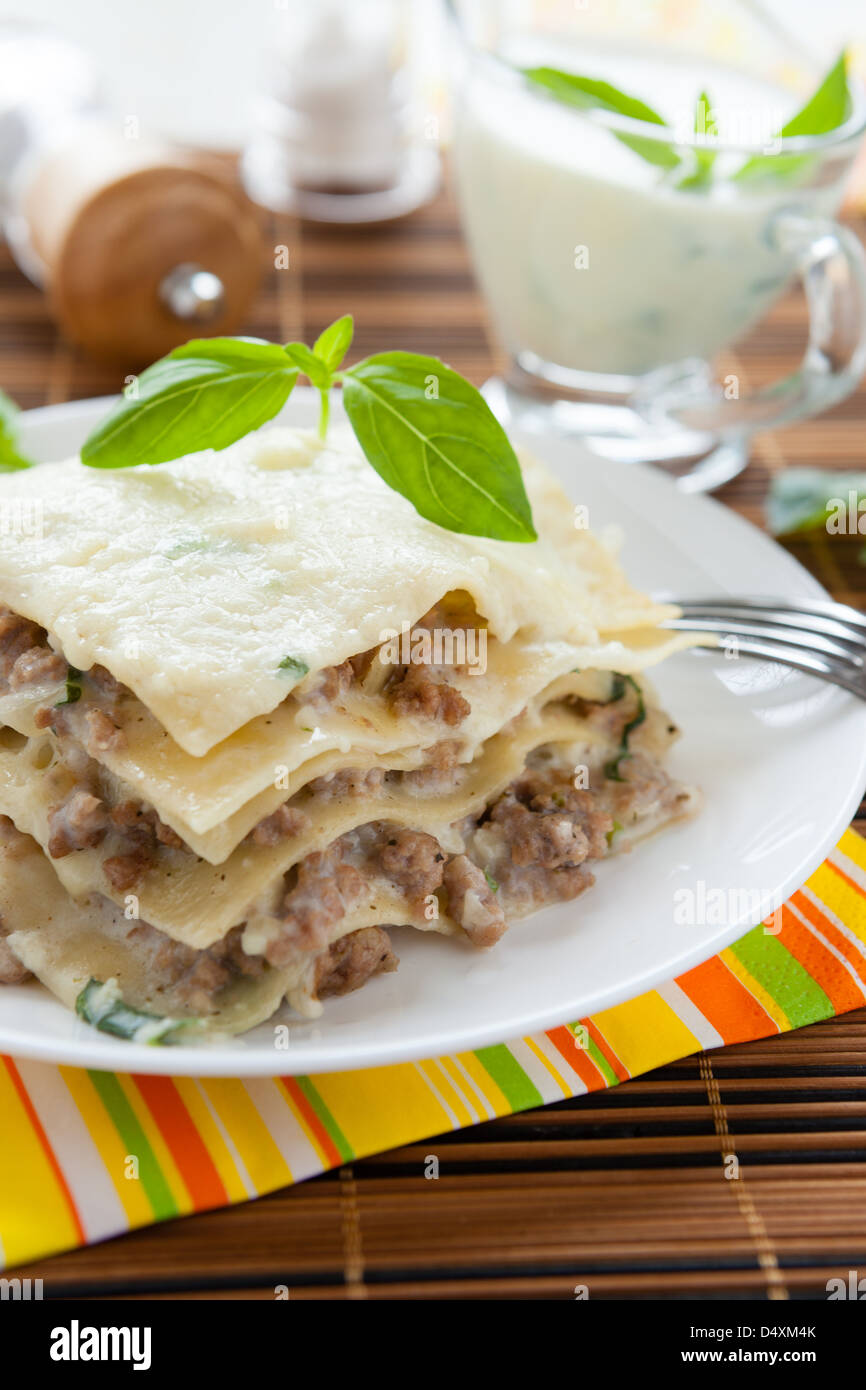 lasagna with béchamel sauce and mozzarella, closeup Stock Photo - Alamy
