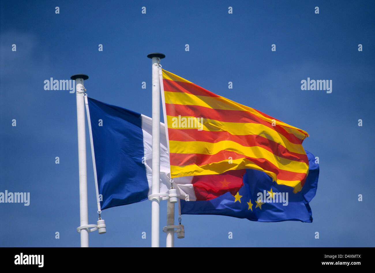 Catalonia flag floating with French and European ones, Eastern Pyrenees ...