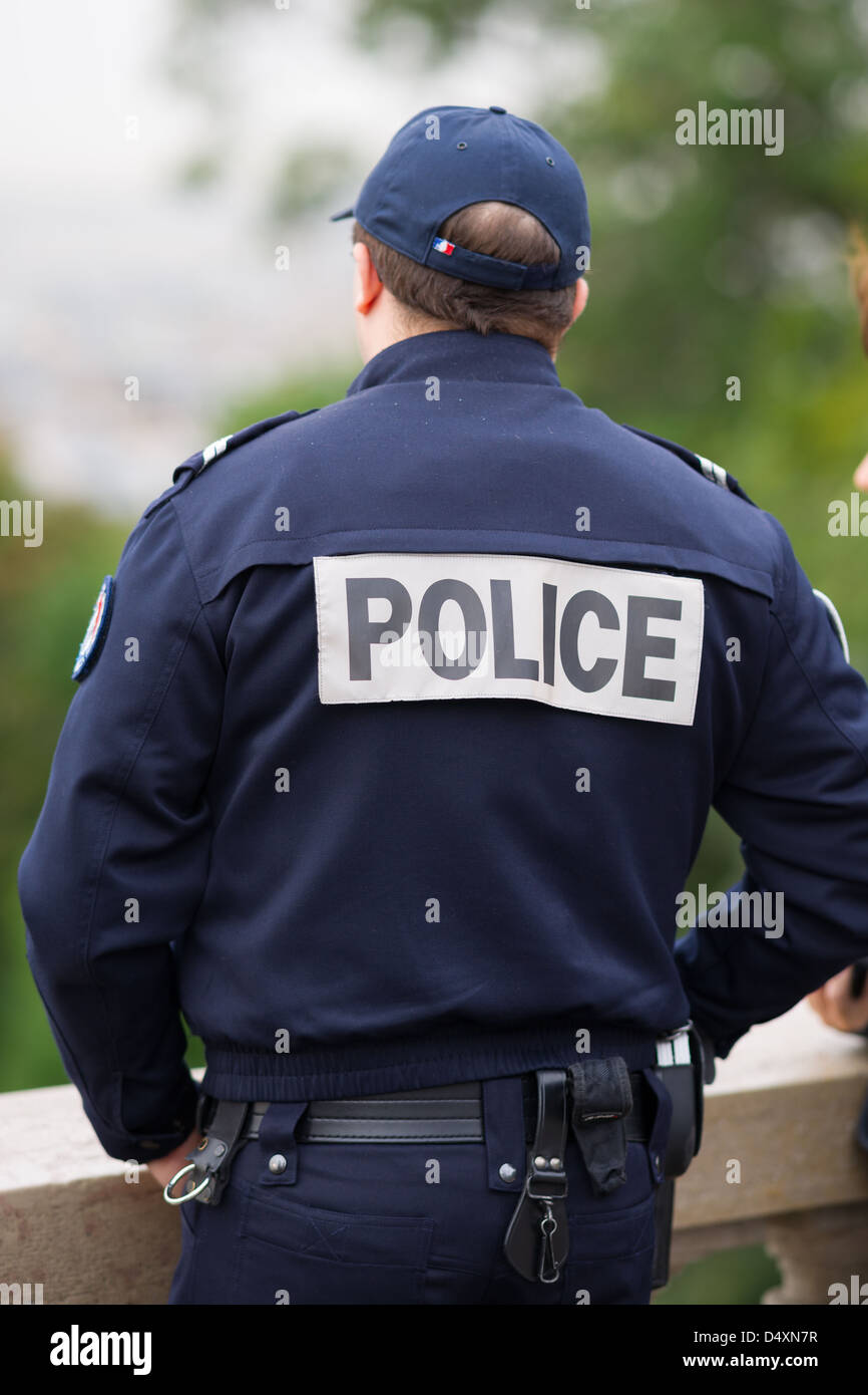 Back of police man Stock Photo - Alamy