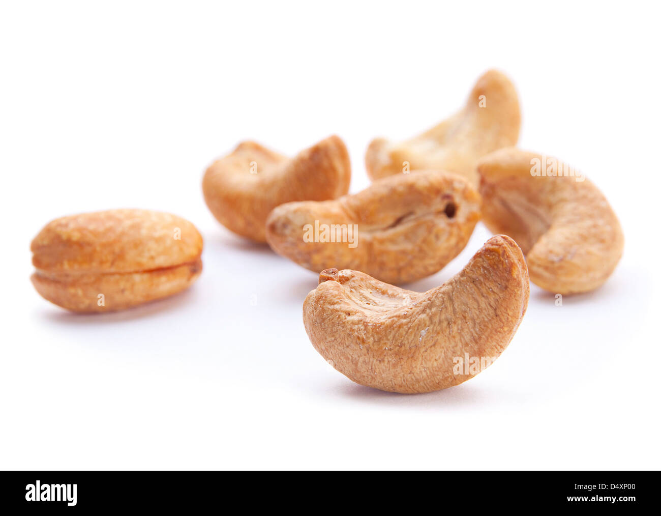 Fried cashew nut closeup isolated on white Stock Photo - Alamy