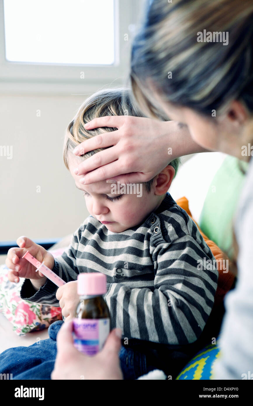 CHILD TAKING MEDICATION Stock Photo - Alamy