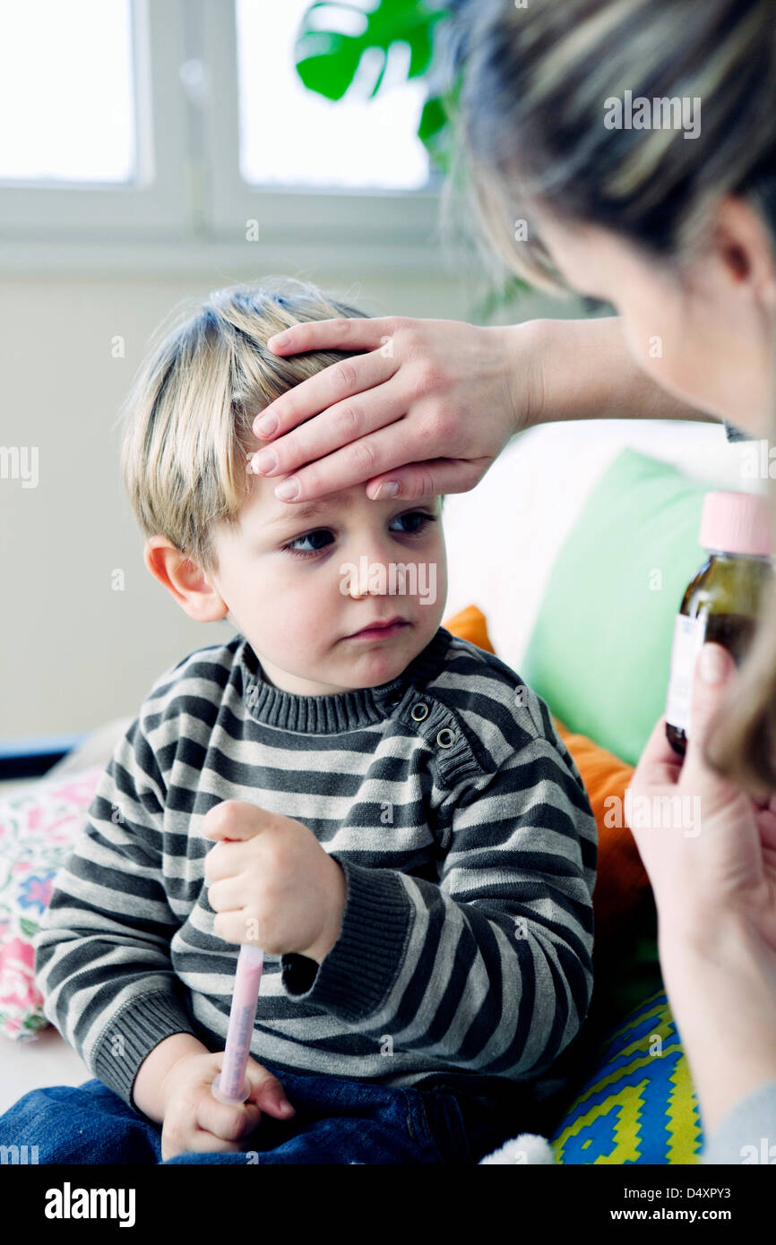 CHILD TAKING MEDICATION Stock Photo - Alamy